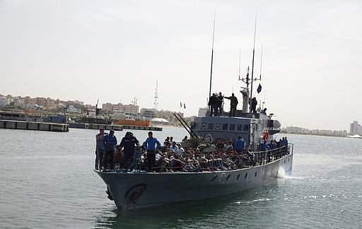 At least 22 migrants dead, dozens missing after twin boat disasters off ...
