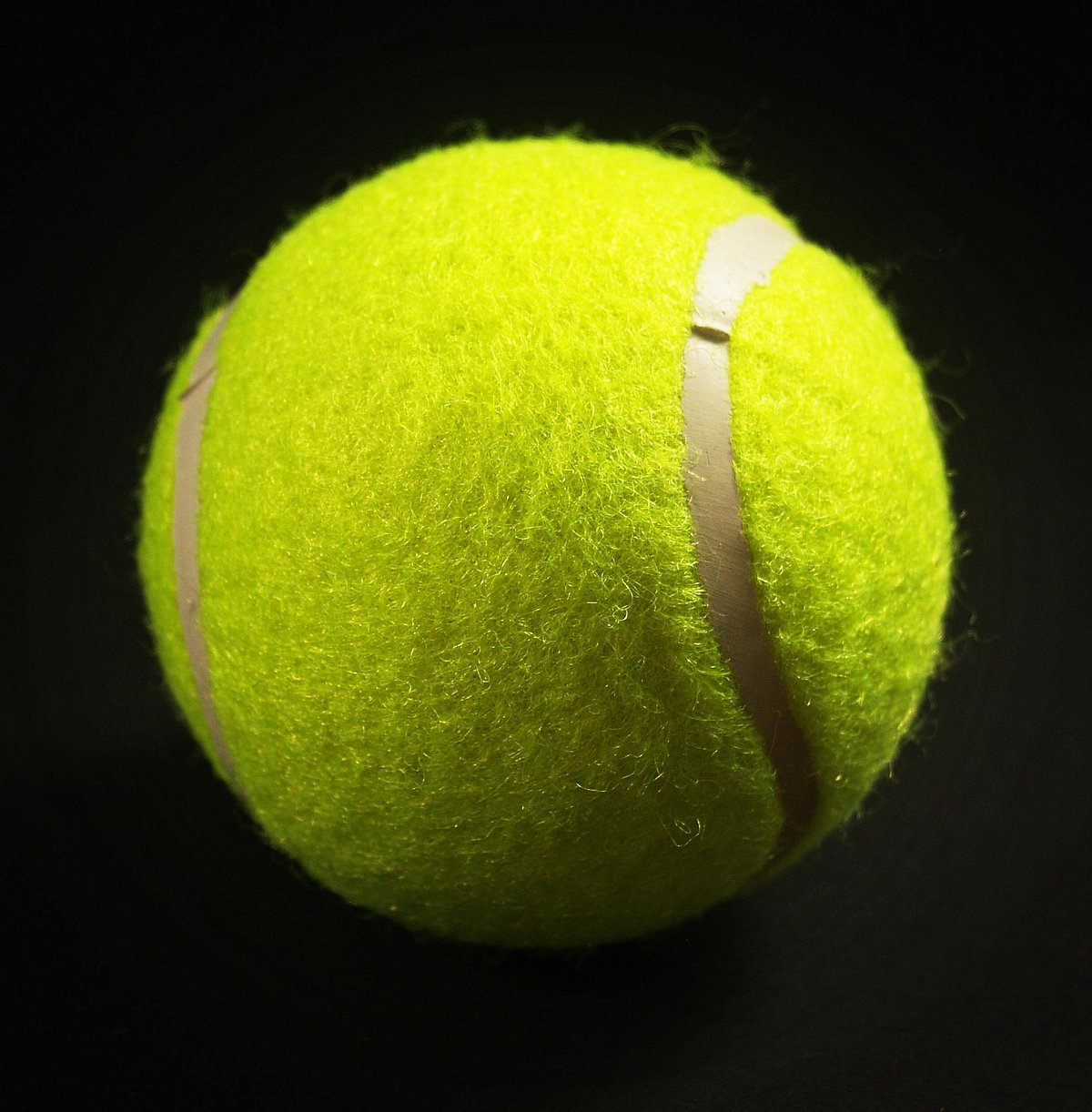 Why Are Tennis Balls Yellow? The Surprising Story Behind It
