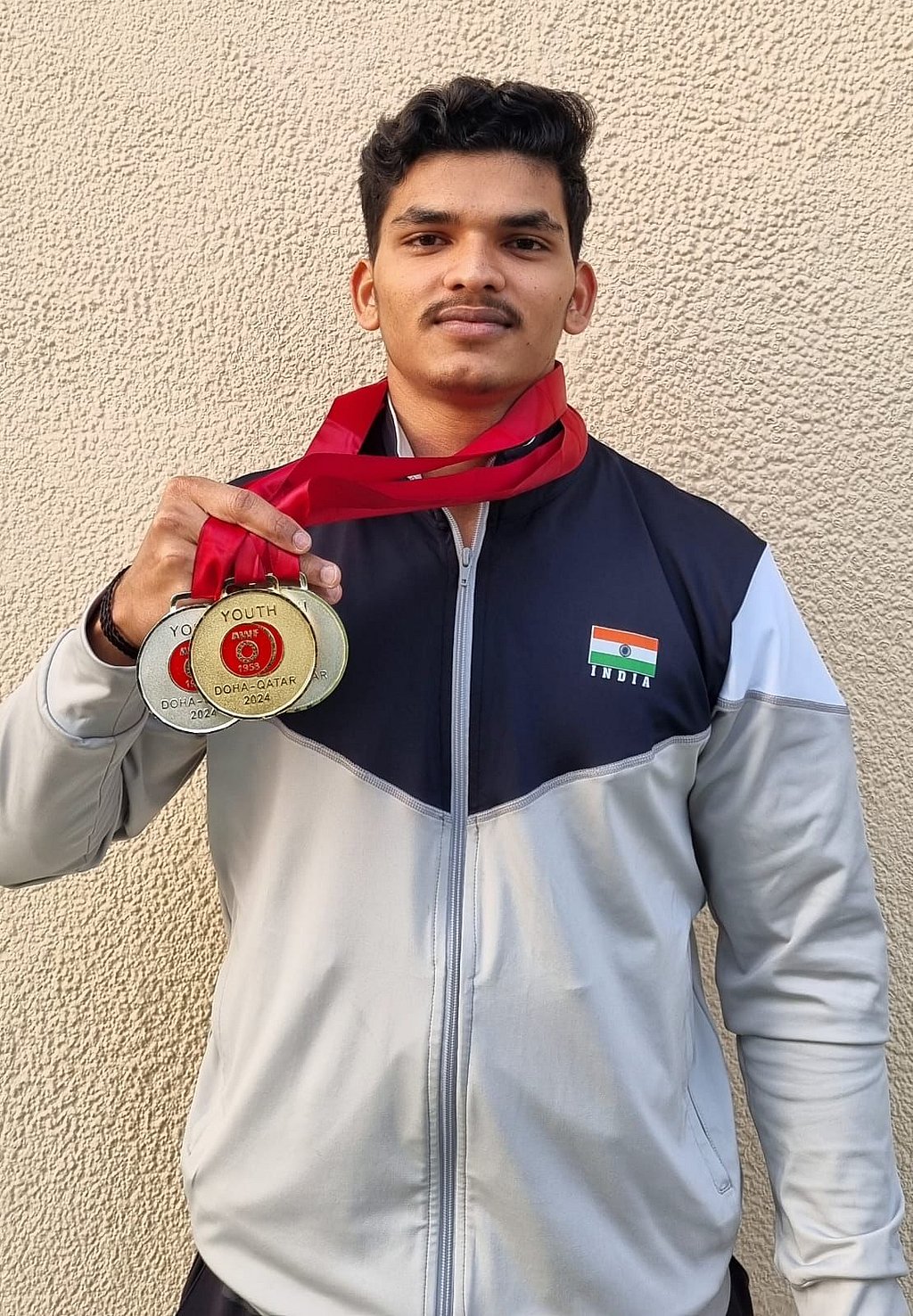 Scrap dealer's son Sairaj claims weightlifting gold in Doha