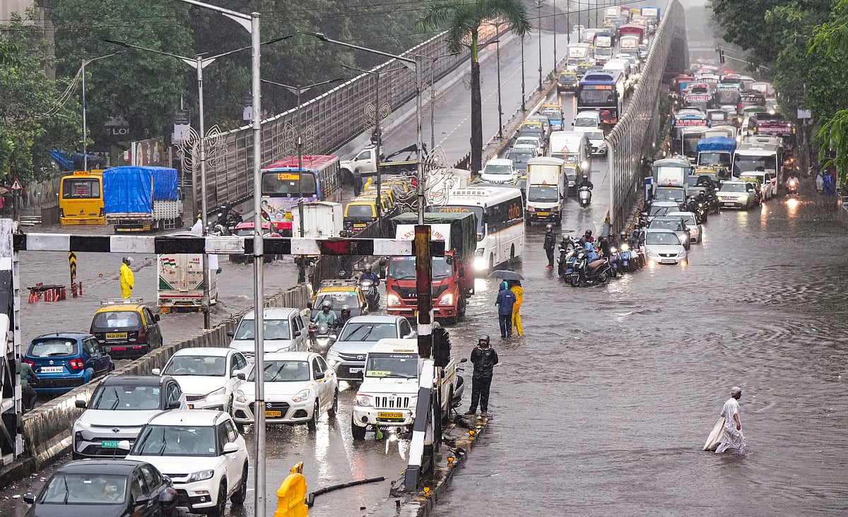 IMD issues orange alert as heavy rains lash Mumbai; disrupt traffic, trains