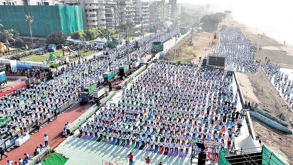 Yoga brings 3,00,105 people together in Vizag for Guinness Record
