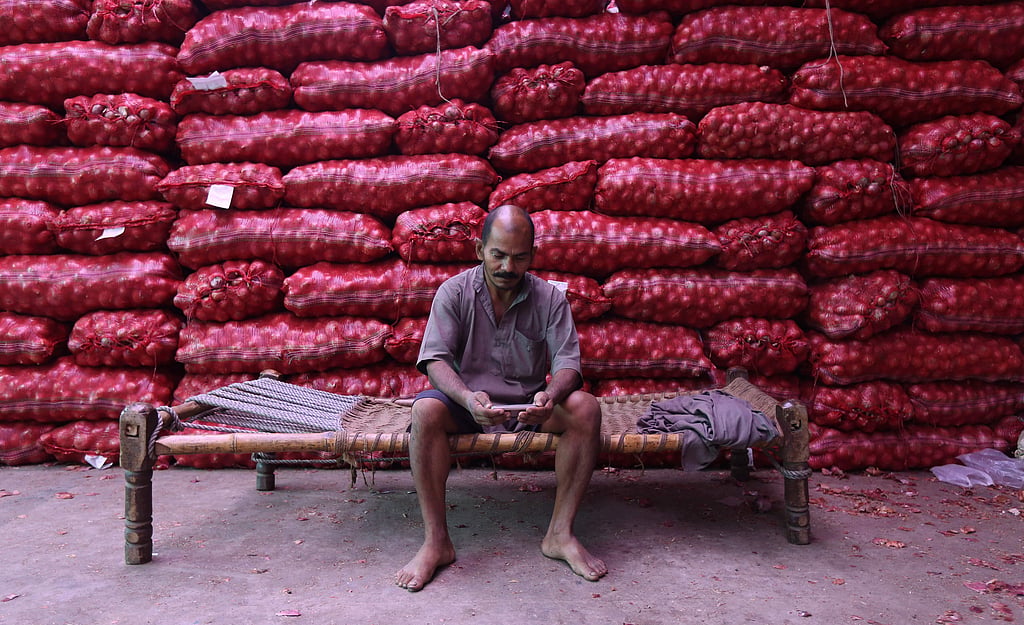 Onion price crash sparks protests in Maharashtra as farmers demand ...