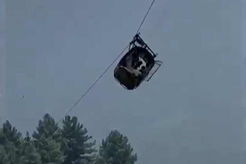 Rescuers save 8 people trapped in cable car dangling above canyon in ...